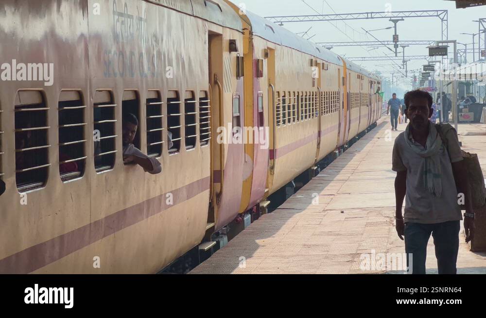 static shot showing train guard waving green flag, In Indian Railway's ...