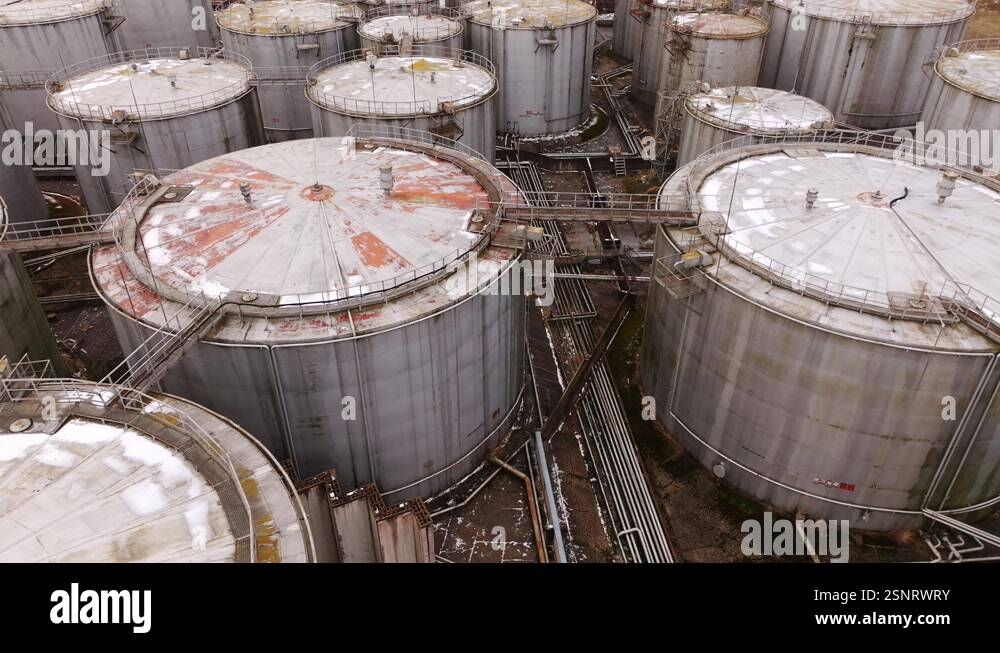 Massive Fuel Storage Facility - Overhead Drone of Aging Tanks ...