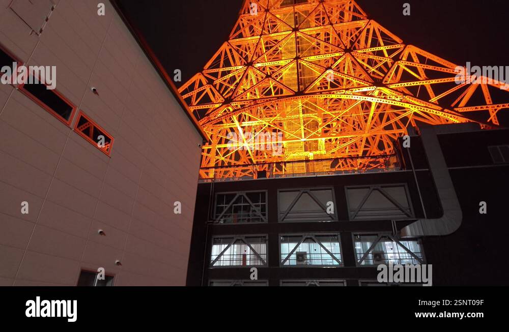 Tokyo Tower lights up the Tokyo skyline at night, creating a breathtaking scene Stock Video ...