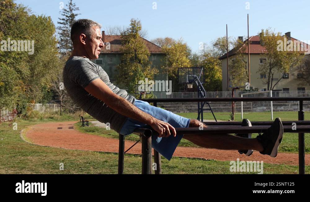 54-Year-Old Fit Man Doing Crunches - Right Profile - Athletic Track ...