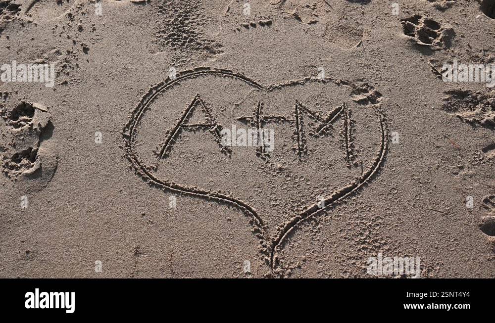 A love message written in the sand on a beach by the sea Stock Video ...