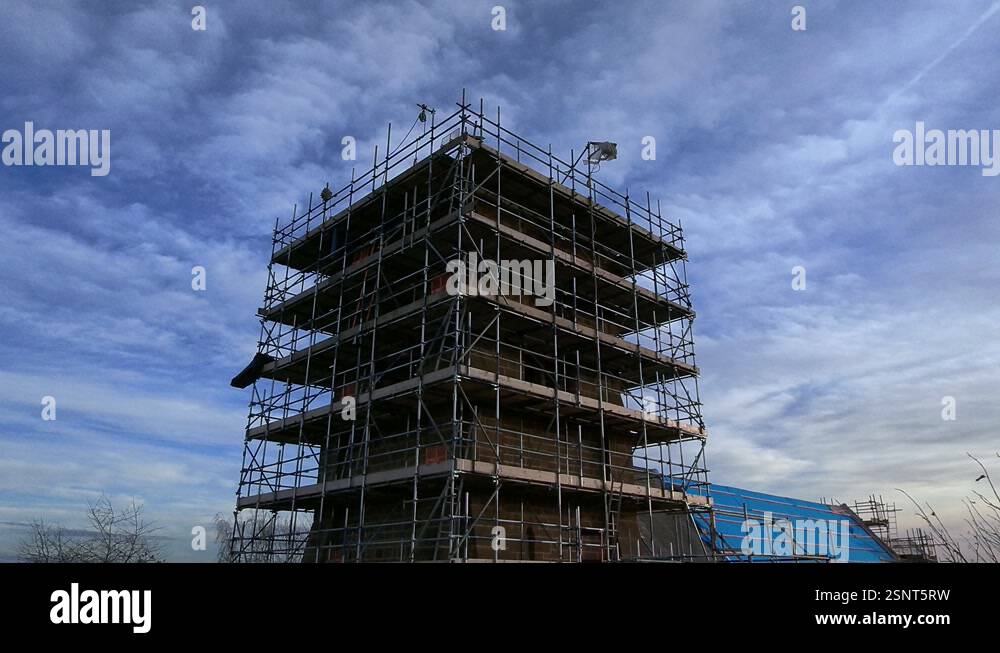 Church tower scaffolding aerial view establishing complex building site ...