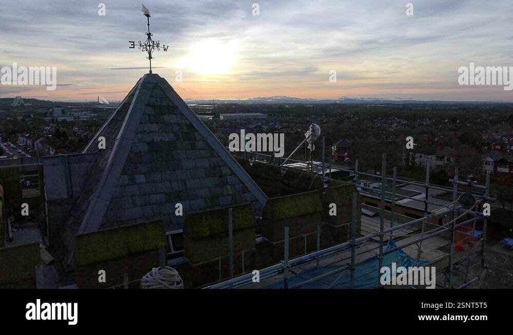 Church steeple with weather vane aerial view circling tower scaffolding ...