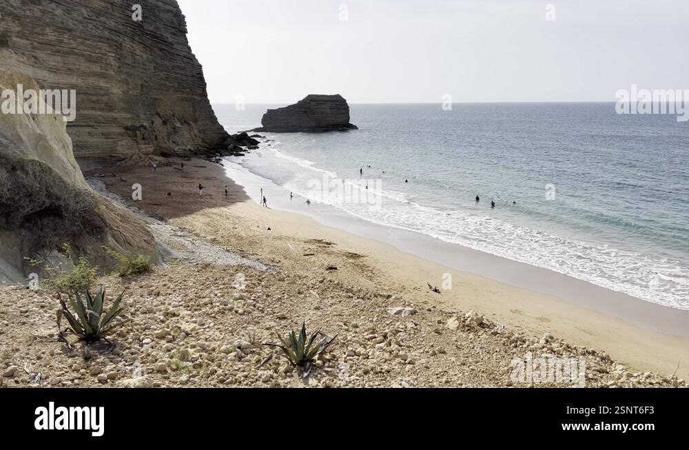Playa El Morro and iconic El Zapato rock at El Morro limestone mountain ...