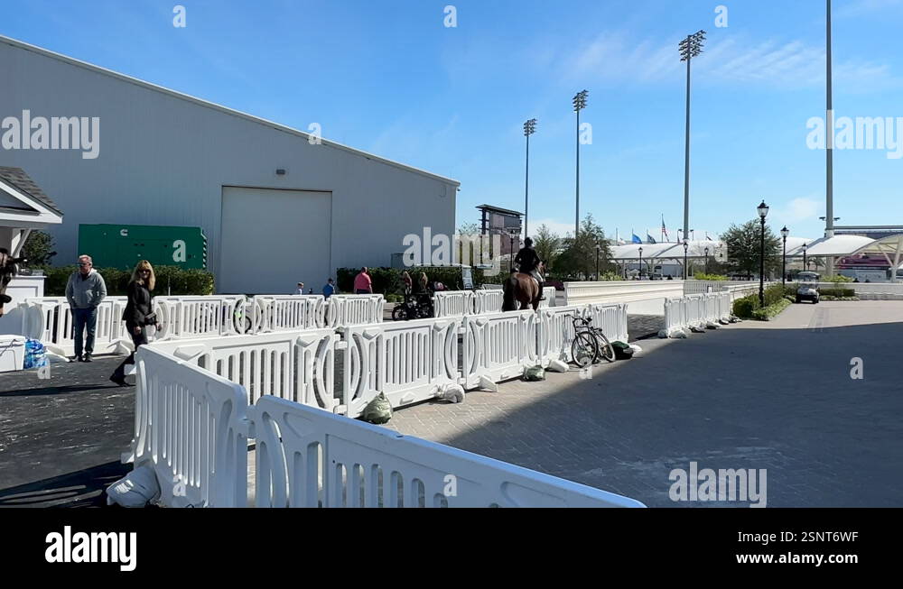 Adult equestrian rider entering competition arena, dressage and show ...