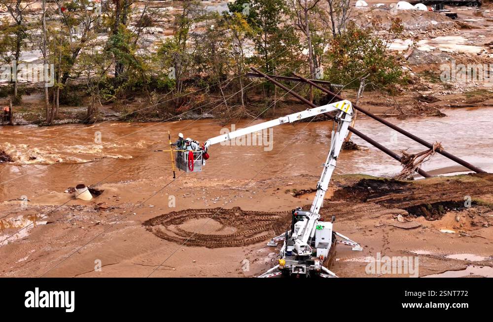 Work on power lines in Swannanoa, NC after hurricane Helene. Linemen ...