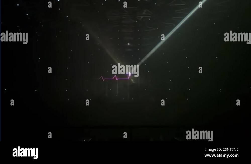 Here is a laser effect illustrating a heart rhythm, with lights forming ...