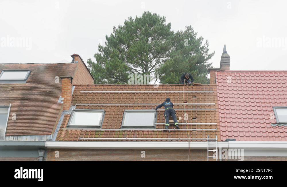 Solar Panels Installation - Men At Work Installing The Mounts On The ...
