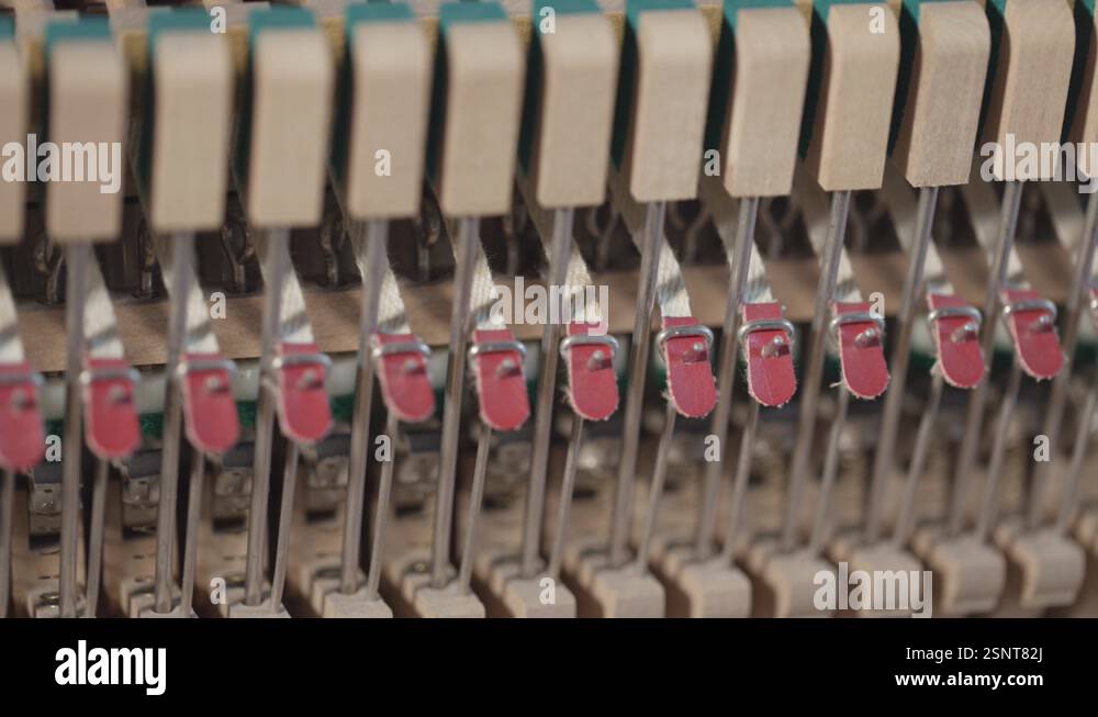 Closeup details of upright piano strings hammer, Tracking shot Stock ...