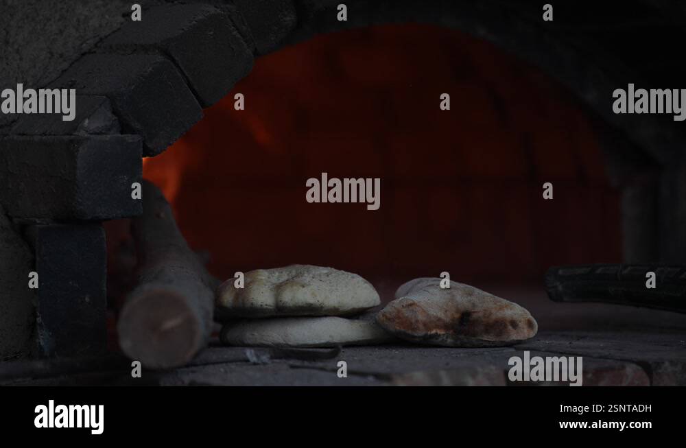 Freshly Baked Warm Simit in Traditional Bakery Oven with Flames and ...