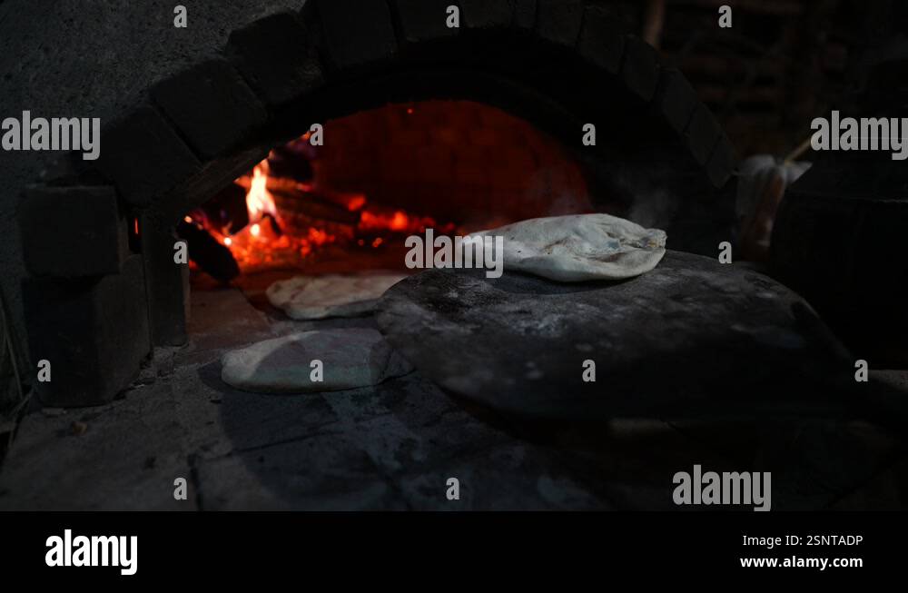 Baker Bakes Bread in Traditional Oven, Flames Heat Delicious ...