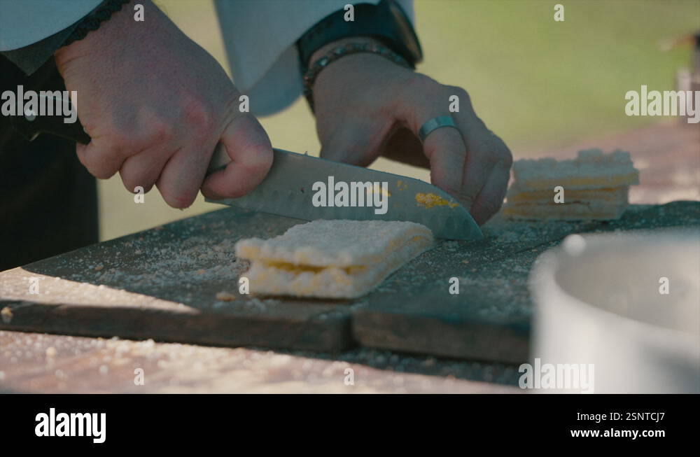 Male Chef hands cutting Tapioca made from cassava starch and fresh ...
