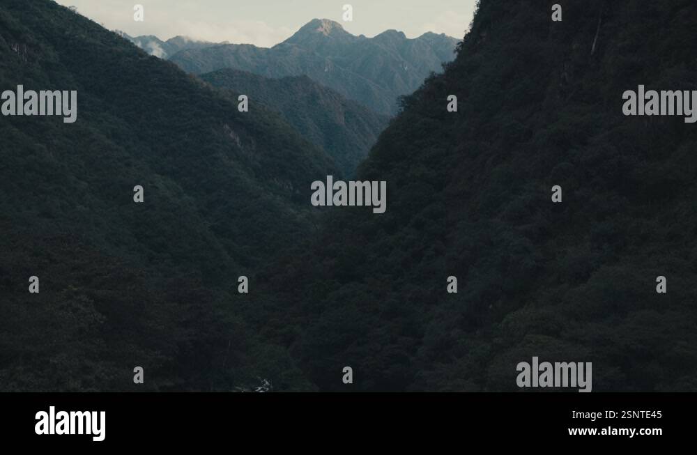 Mountain Ridge Towering Over Remote Village In Southern Peru. Aerial ...