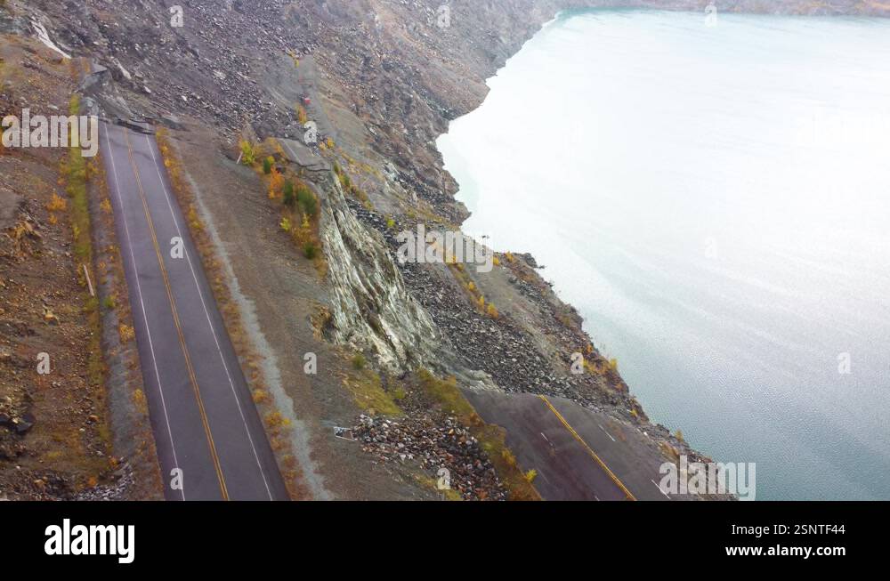 Devastating aerial view of collapsed road likely due to landslide or ...