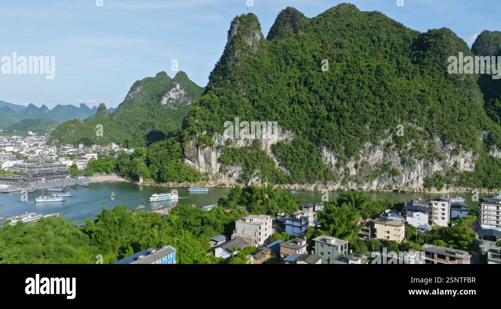 Drone tilting over the Xing ping historical village, sunny, summer day ...