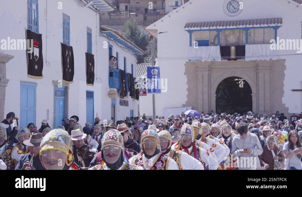 Masked Men March in Traditional Costumes with Cathedral Backdrop ...