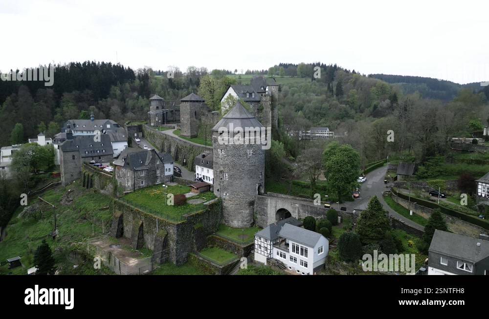 Pan out or flying outward from Monschau's castle. This footage was made ...