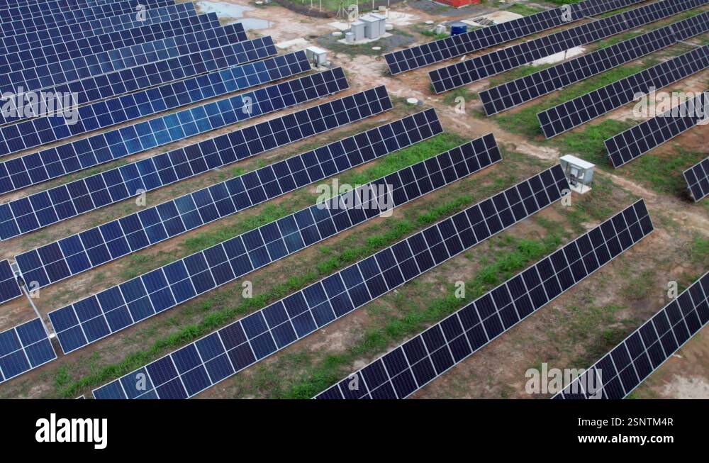 Curved Aerial View of Small Industrial Solar Panel Green Energy Farm ...