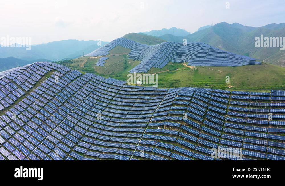 Huge solar panel farm nestled on the lush Taihang Mountain slopes ...