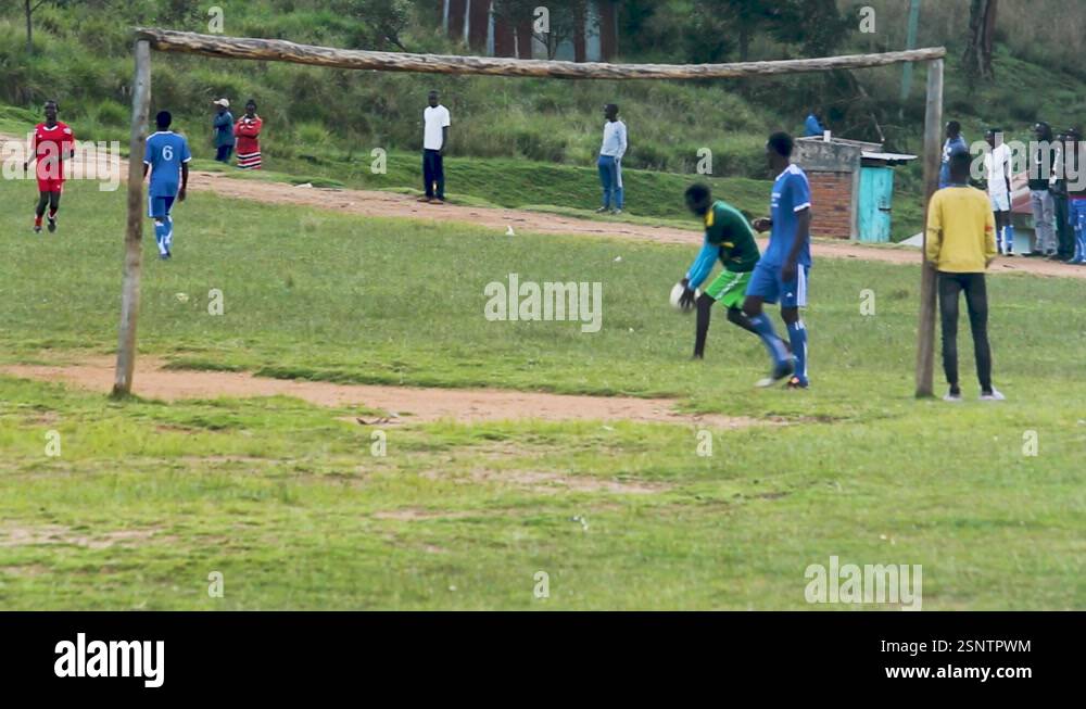Africa men playing in the village football pitch. Games in rural parts ...