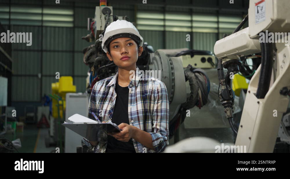 Female engineer inspecting industrial machines Stock Videos & Footage ...