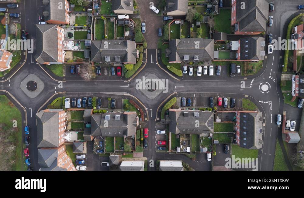 A detailed aerial view of old brutalist offices in active redevelopment ...