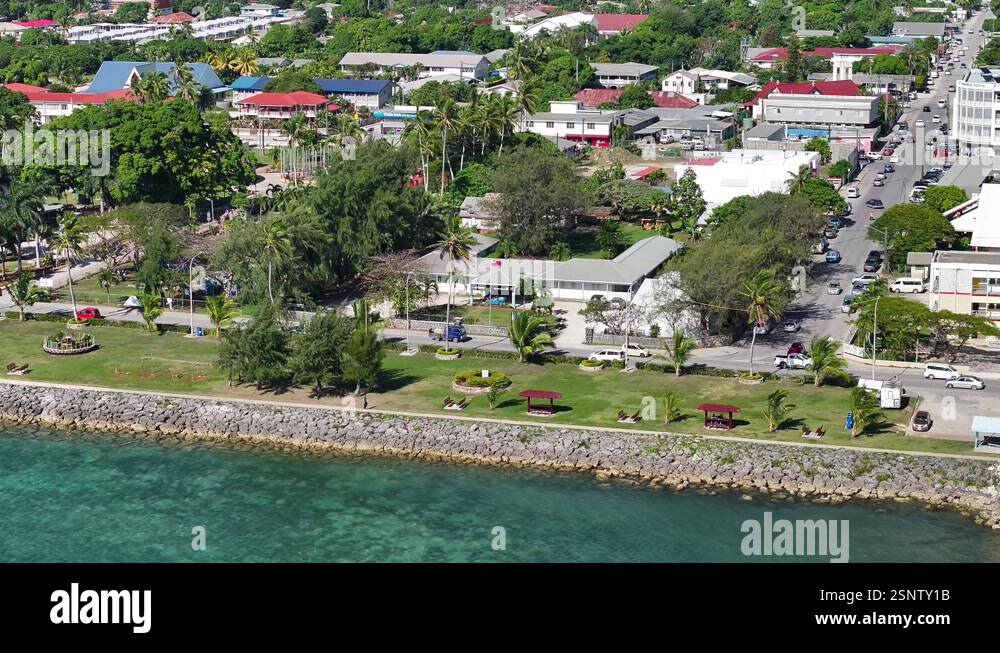 Promenade and road with commercial buildings on Tongatapu shore ...