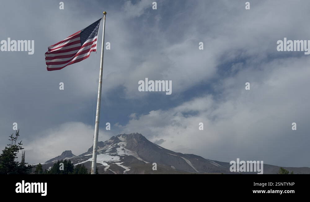 American Flag Waving on Flagpole with Snowy Mount Hood Peak in Oregon ...