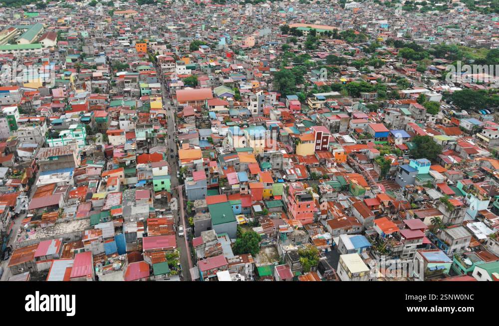 An aerial shot showcasing a densely populated squatter settlement in ...