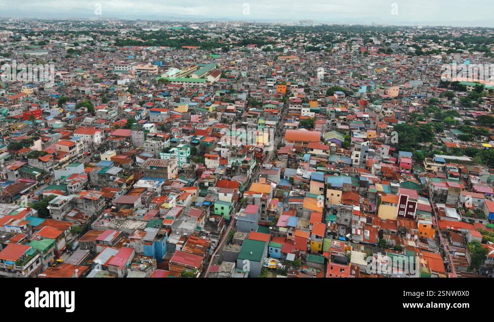 An aerial shot showcasing a densely populated squatter settlement in ...