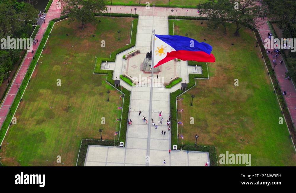 Aerial View of Rizal Monument and Luneta Park with the Philippine Flag Stock Video Footage - Alamy