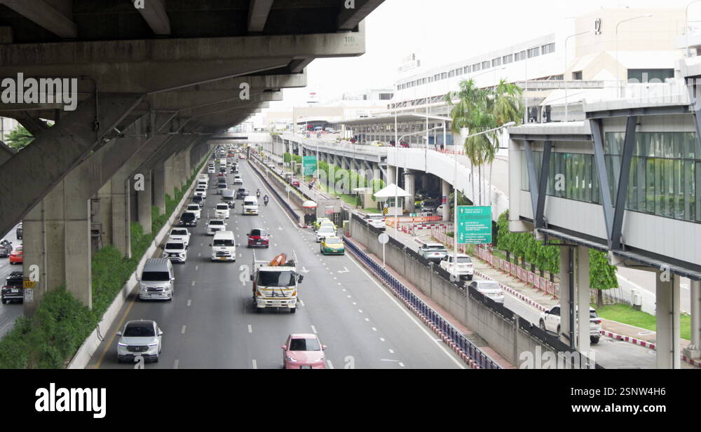 Witness the bustling traffic flow outside an airport terminal ...