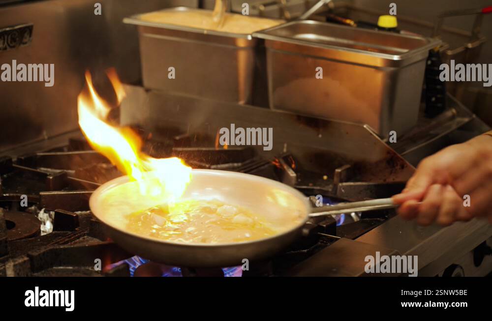 Professional Chef Cooking Meal Over Commercial Kitchen Stove Inside ...