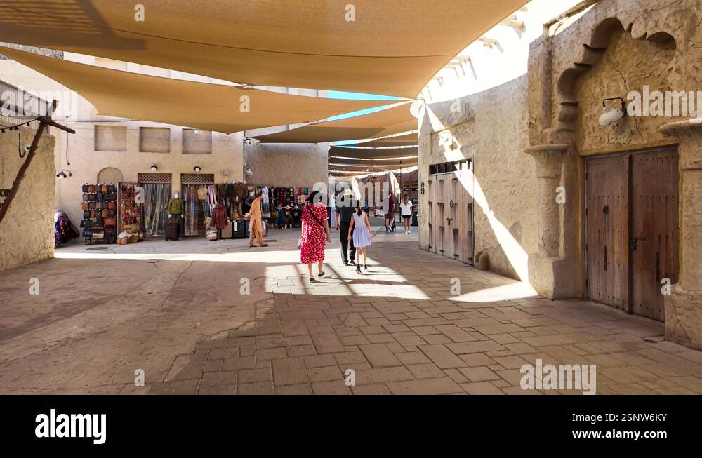 People in Al Seef, waterfront promenade in Dubai's Al Fahidi district ...