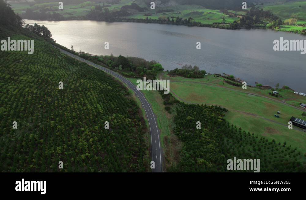 Drone shot of Pokuru Road winding around New Zealand's Waikato River ...