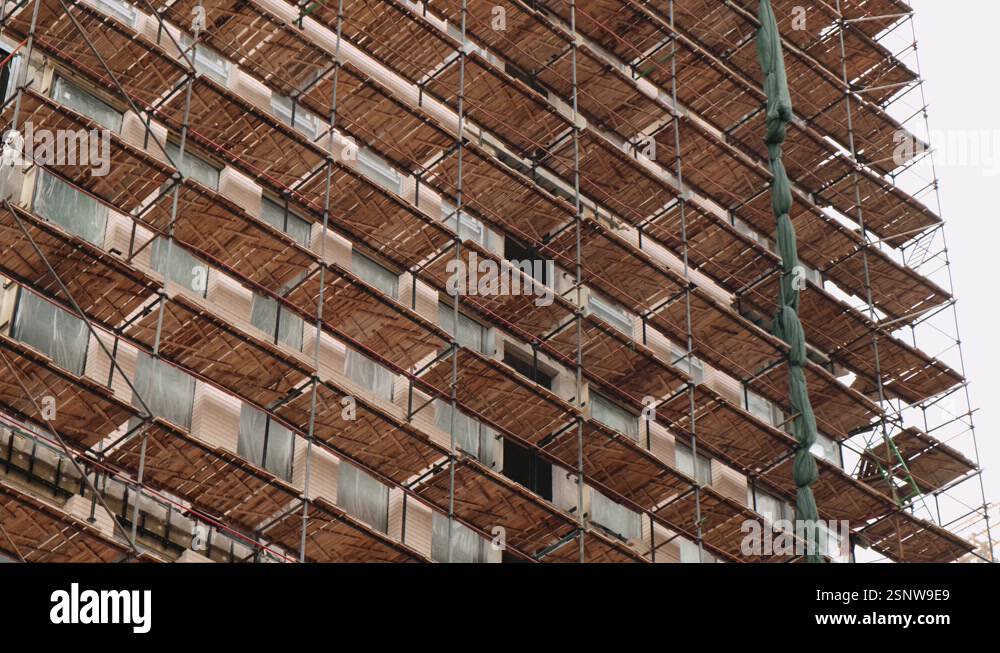 Scaffolding on the facade of a new multi-storey modern residential ...