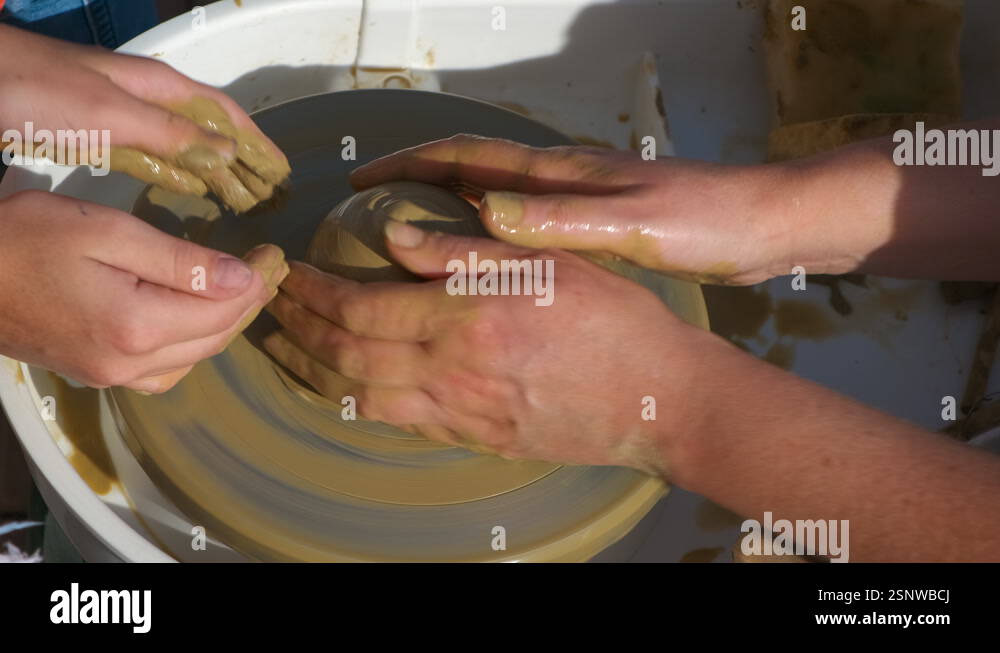 Arms prepare clay for pot Stock Video Footage - Alamy