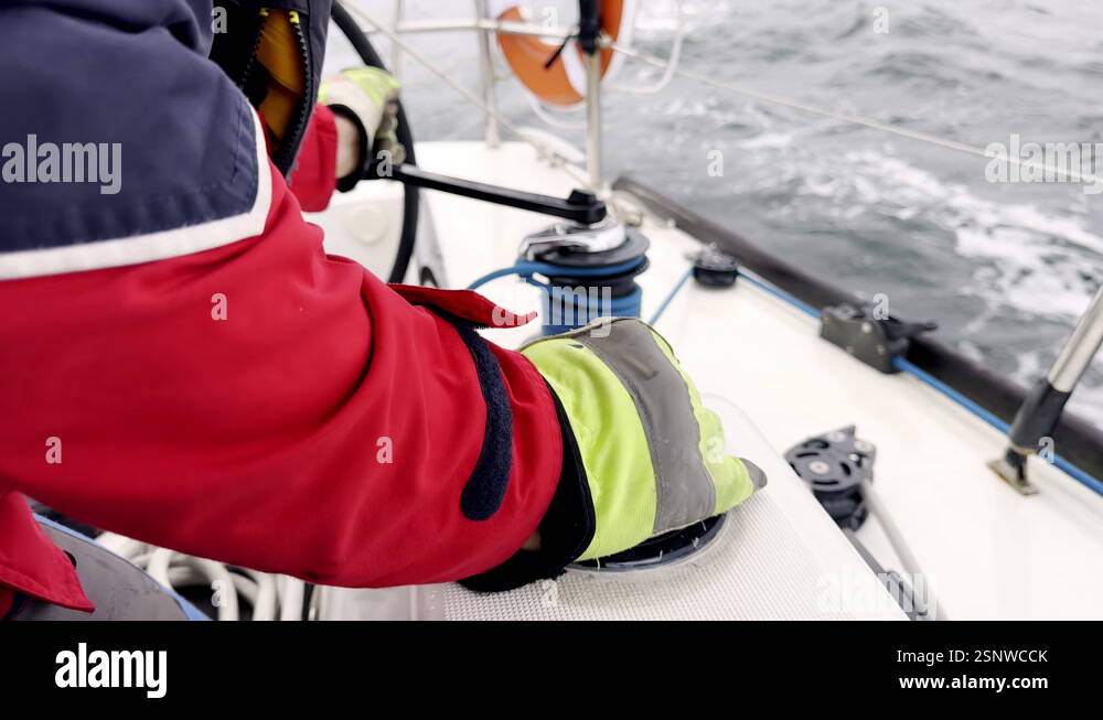 Controlling the Course Close-Up View of a Sailor Adjusting Lines on a ...