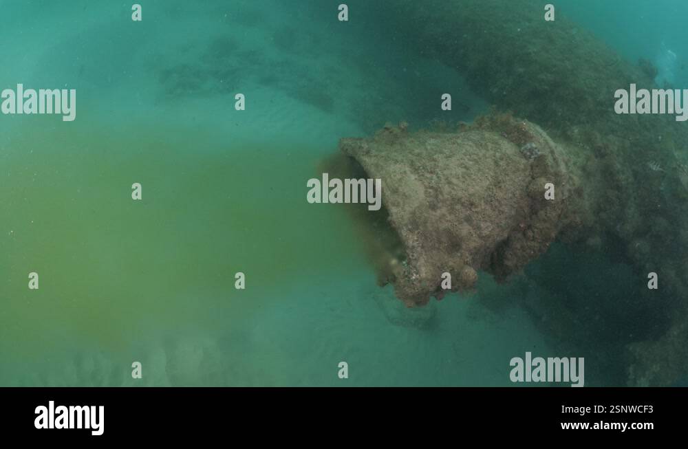 Deep underwater sewer outlet pipe dispersing treated wastewater into ...