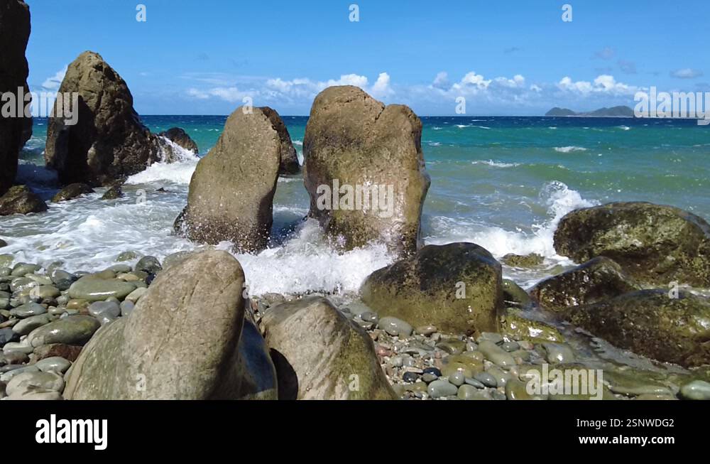 Sunny Day with Rock Formations and Small Waves at Banbanon Beach ...