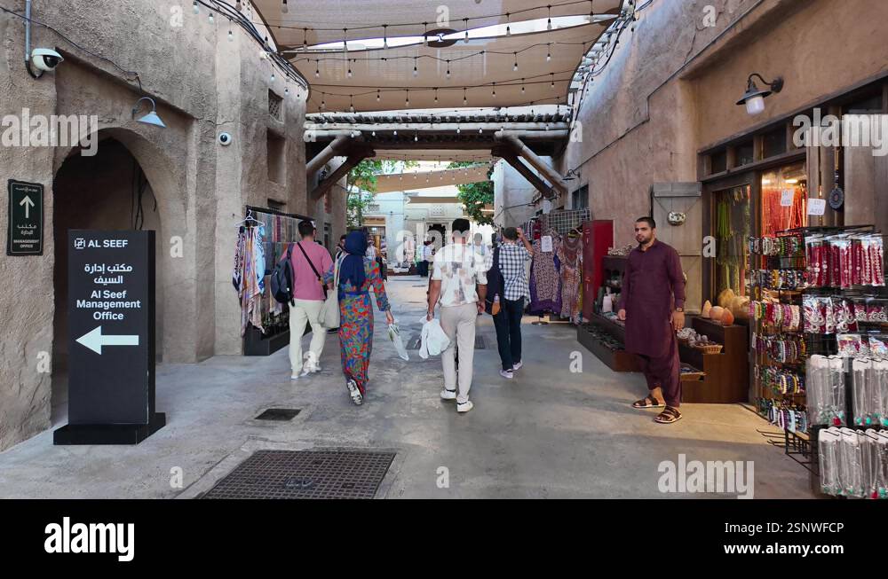 People in Al Seef, waterfront promenade in Dubai's Al Fahidi district ...