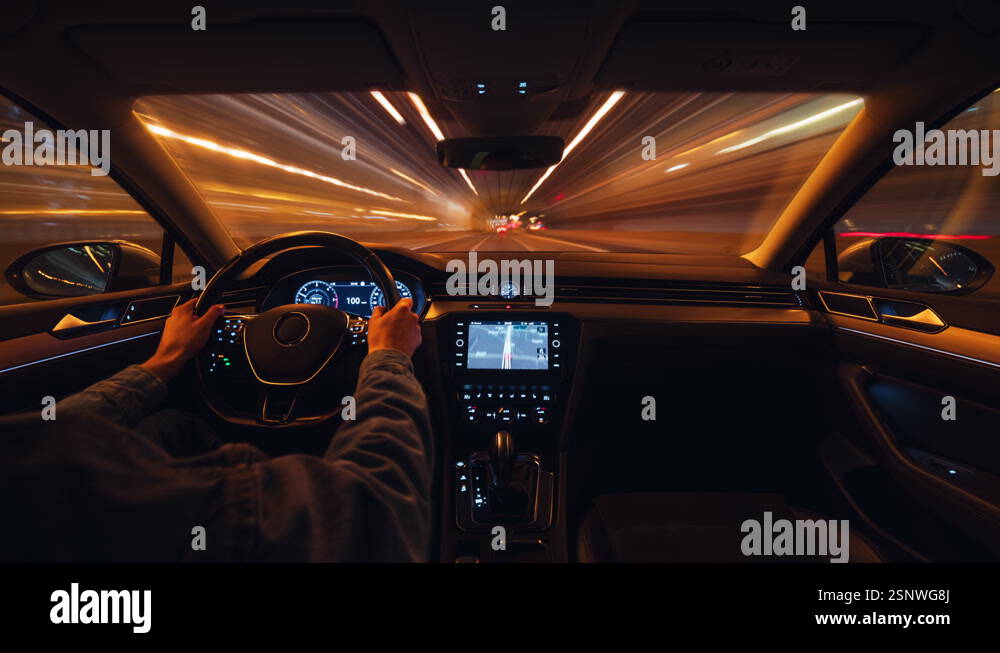Time-lapse high speed drive in city street at night, traffic blurry ...