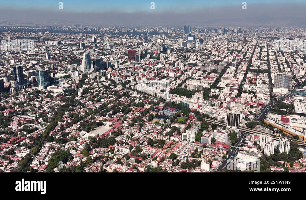 Smog-filled sky casts a hazy glow over Mexico City, as seen from above ...
