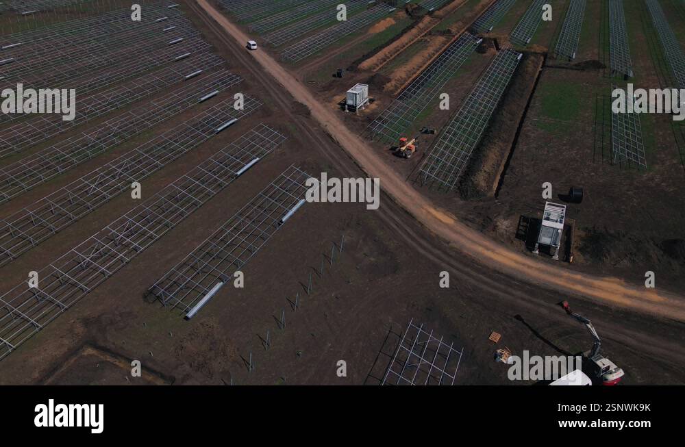 Aerial view of solar park construction in Szolnok with equipment and ...