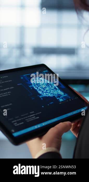 Vertical video Data center technician using artificial intelligence on tablet to prevent ...