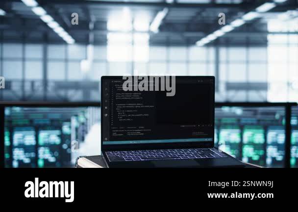 Laptop used by data center system administrators using artificial intelligence tech, handheld ...