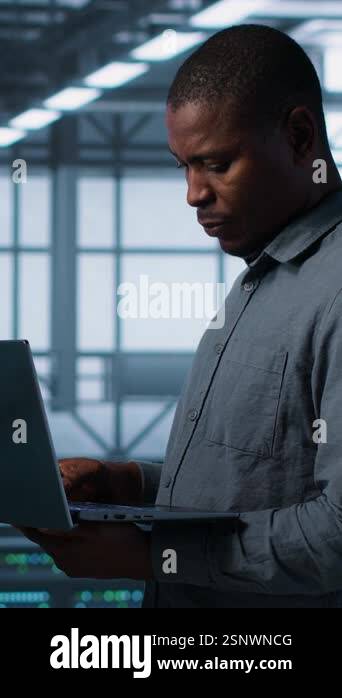 Vertical Video Portrait Of Happy System Administrators In Data Center Using Devices Verifying