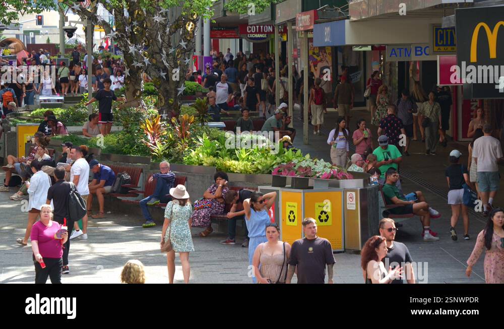 Bustling downtown Brisbane city with crowds of people streaming through ...