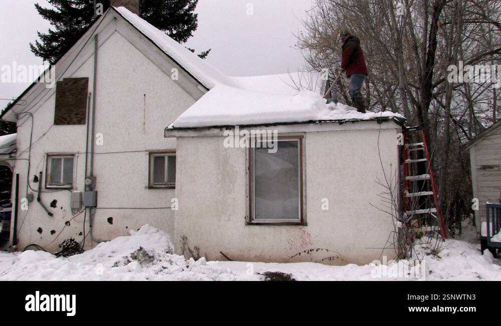Snow removal house roof M HD Stock Video Footage - Alamy