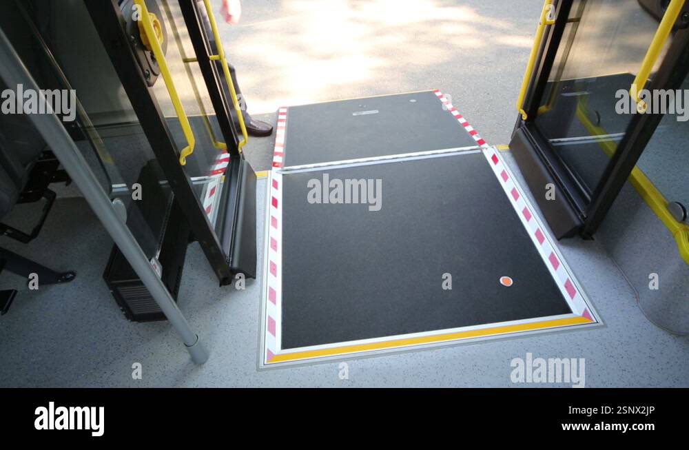 Driver closing by hand the wheelchair ramp on the bus Stock Video ...